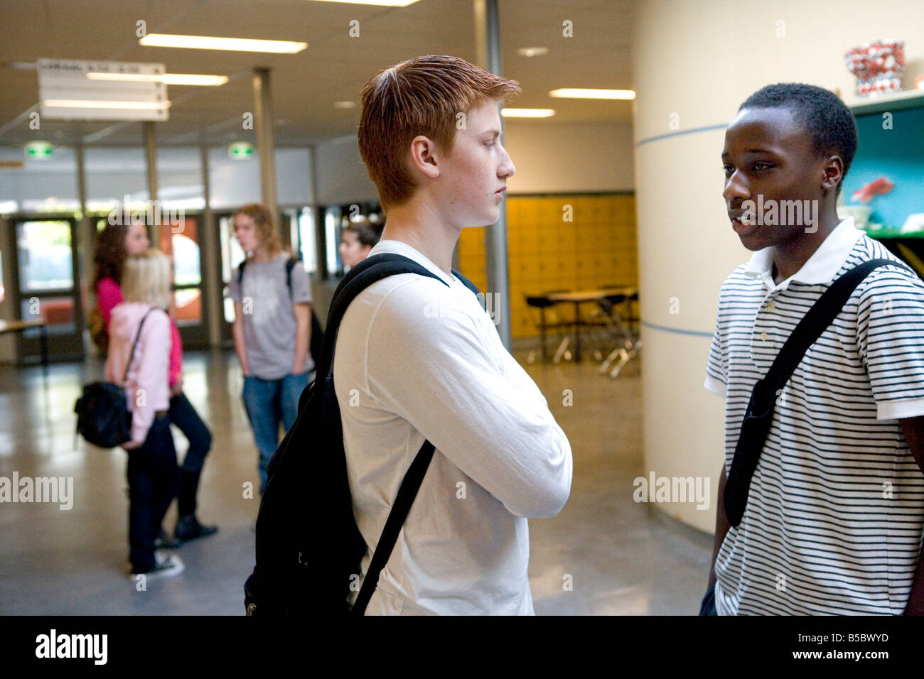 Teenage boys talking in the school hall Stock Photo - Alamy