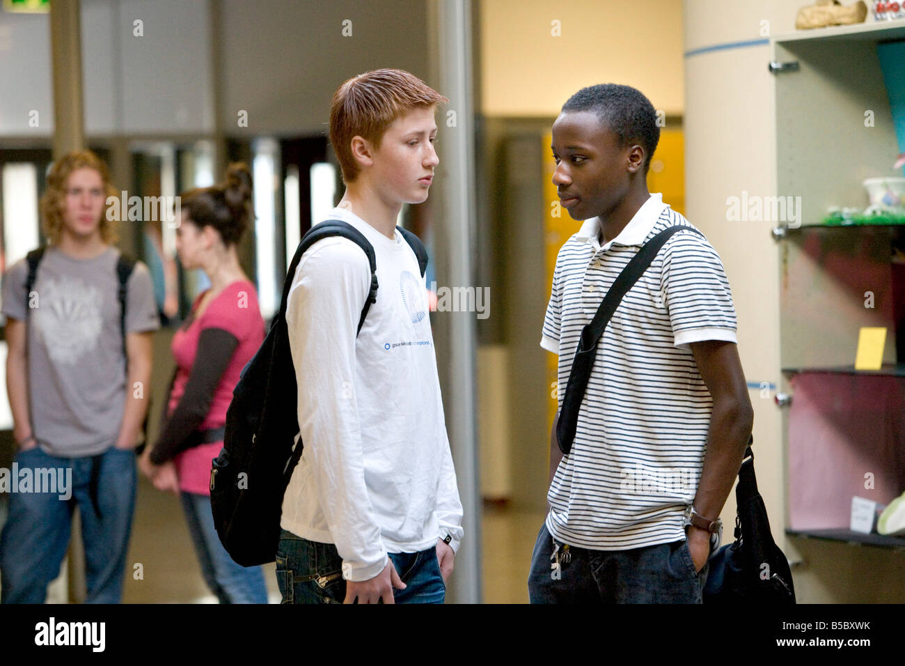 Teenage boys talking in the school hall Stock Photo - Alamy