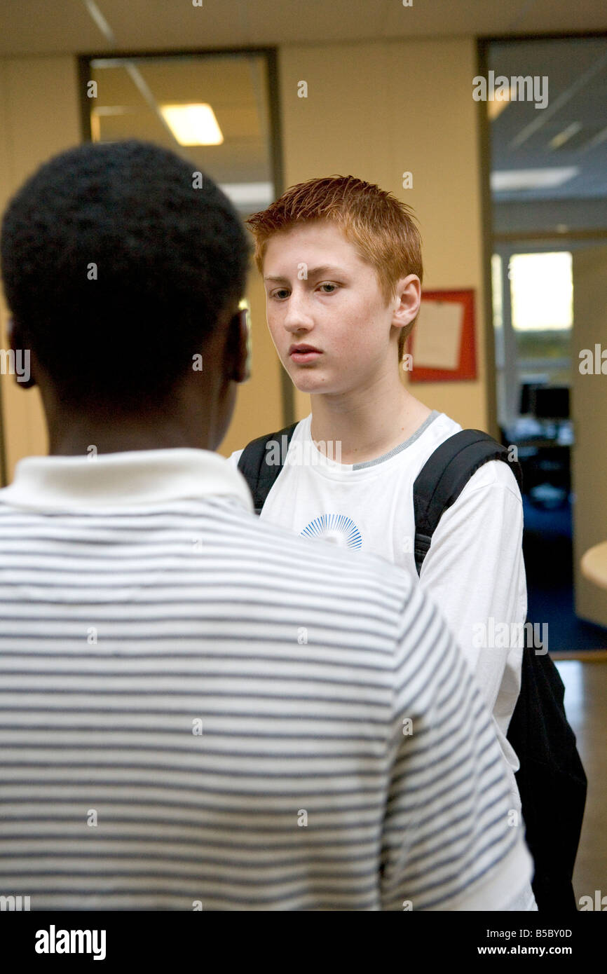 Teenage boys talking in the school hall Stock Photo - Alamy