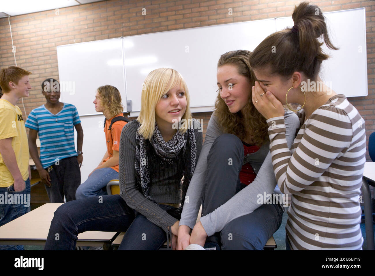 Classroom students talking whisper hi-res stock photography and images ...