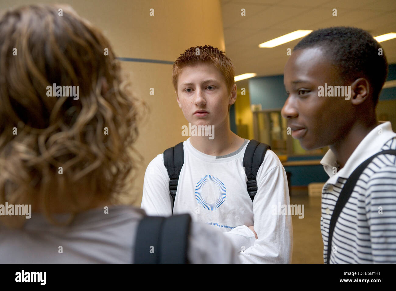Teenage boys talking in the school hall Stock Photo - Alamy