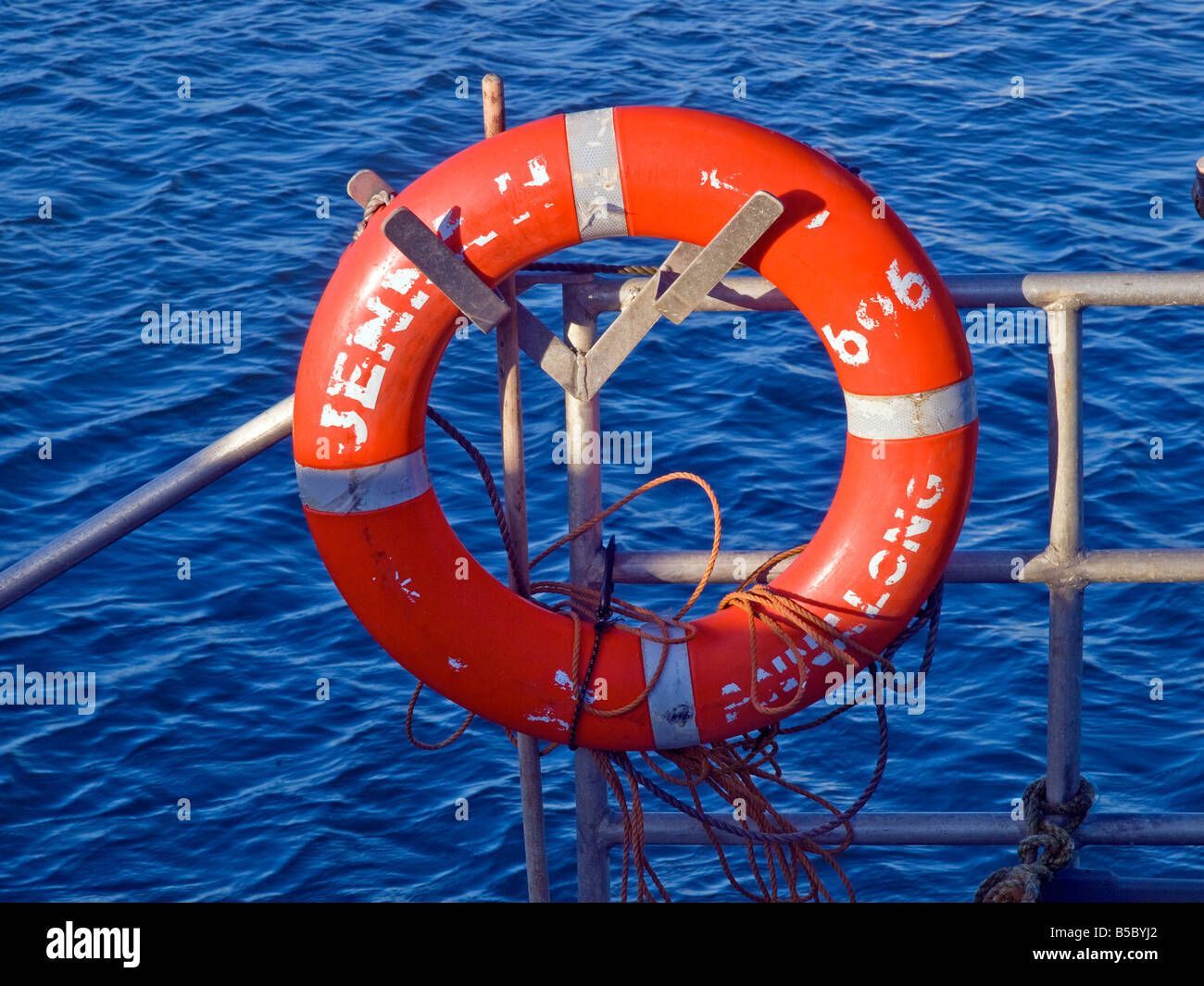 Life belt on railing Stock Photo - Alamy