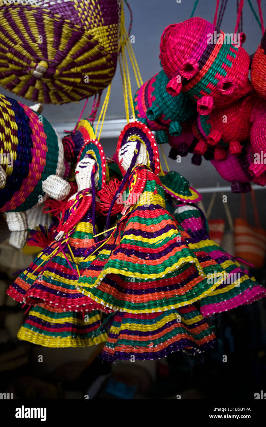 Hand made dolls hanging in a souvenir shop in Montecristi, Ecuador ...