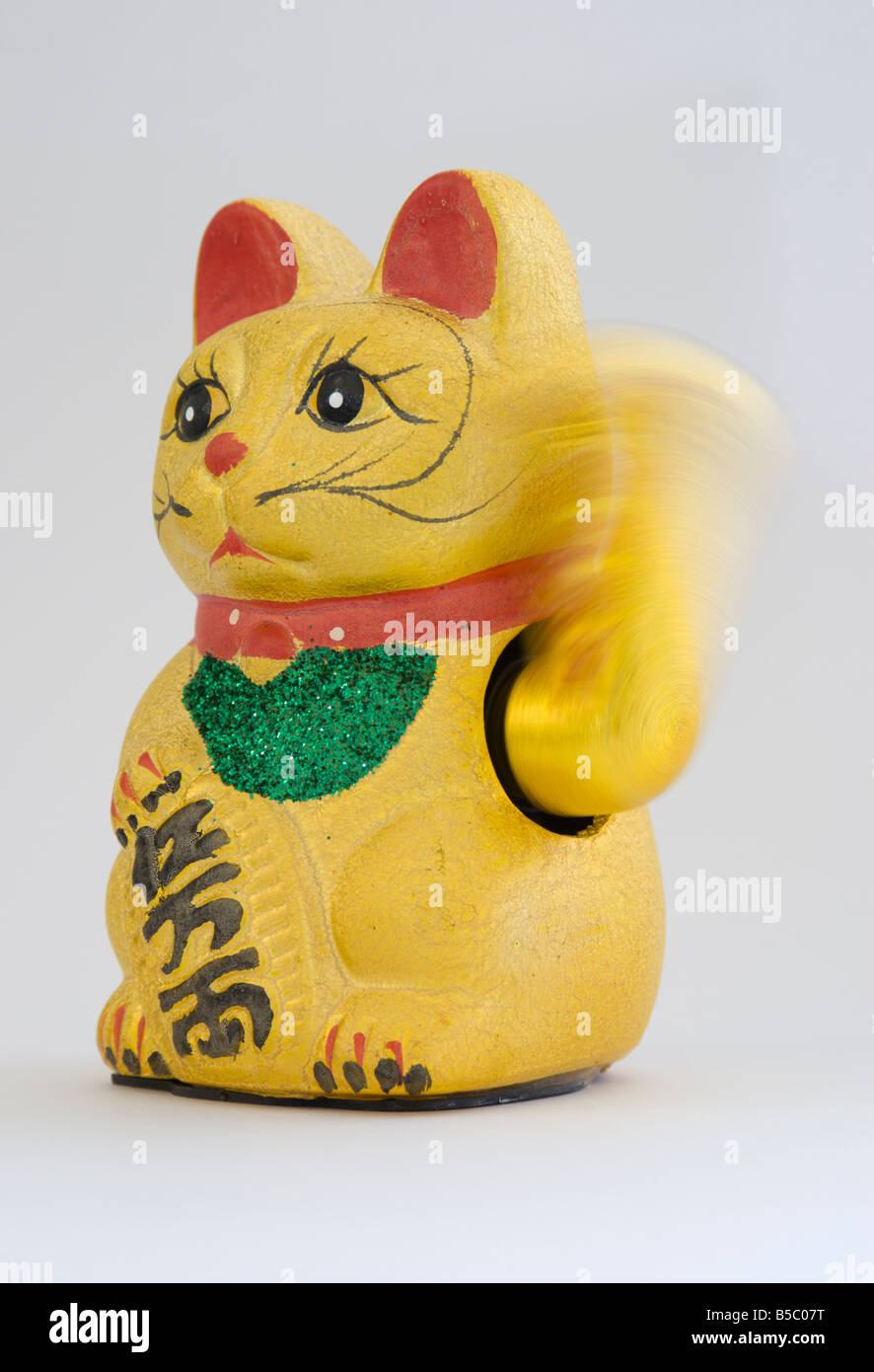 A waving cat statue Stock Photo - Alamy