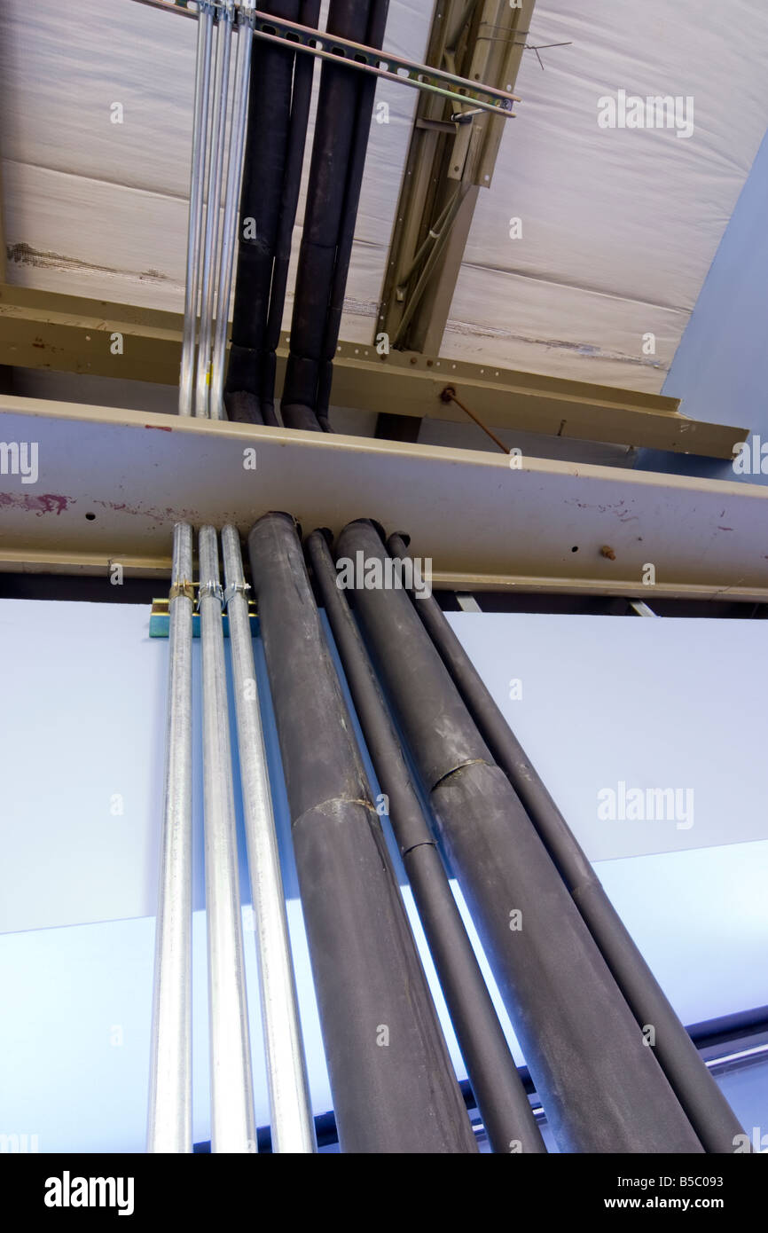 Several pipes on the ceiling and wall of a warehouse PROPERTY RELEASED ...