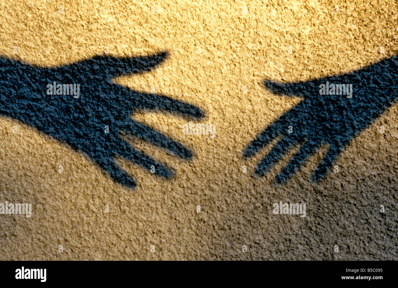 Helping hand - Hands of adult and child joining Stock Photo - Alamy