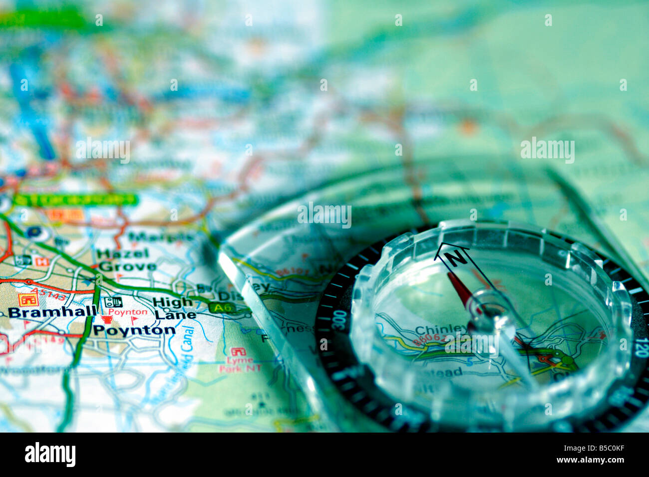 Compass on road map close up Stock Photo - Alamy