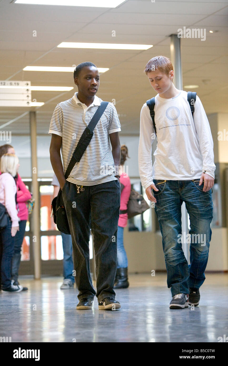 Teenage boys talking in the school hall Stock Photo - Alamy