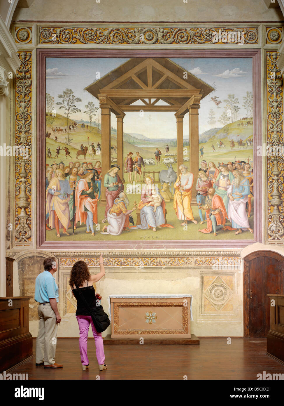 Two people stand in admiration of a large mural Stock Photo - Alamy