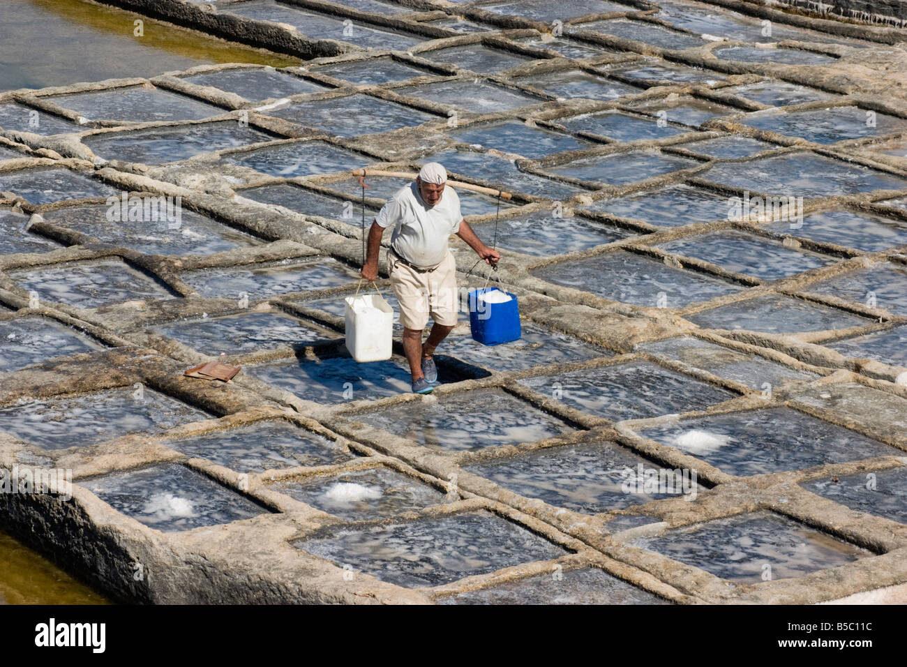 Collecting salt from salt pan hi-res stock photography and images - Alamy