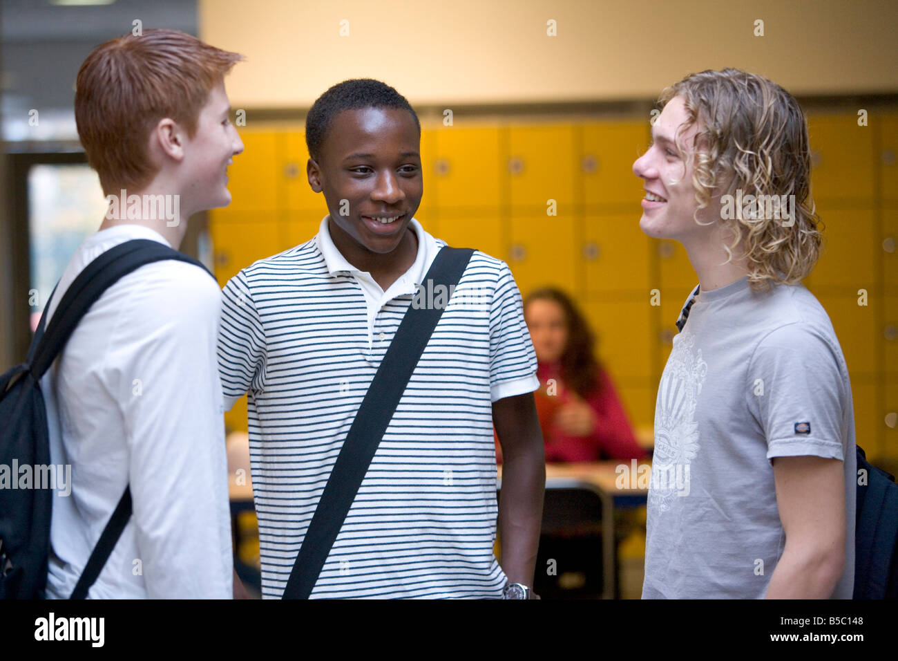 Teenage boys talking in the school hall Stock Photo - Alamy