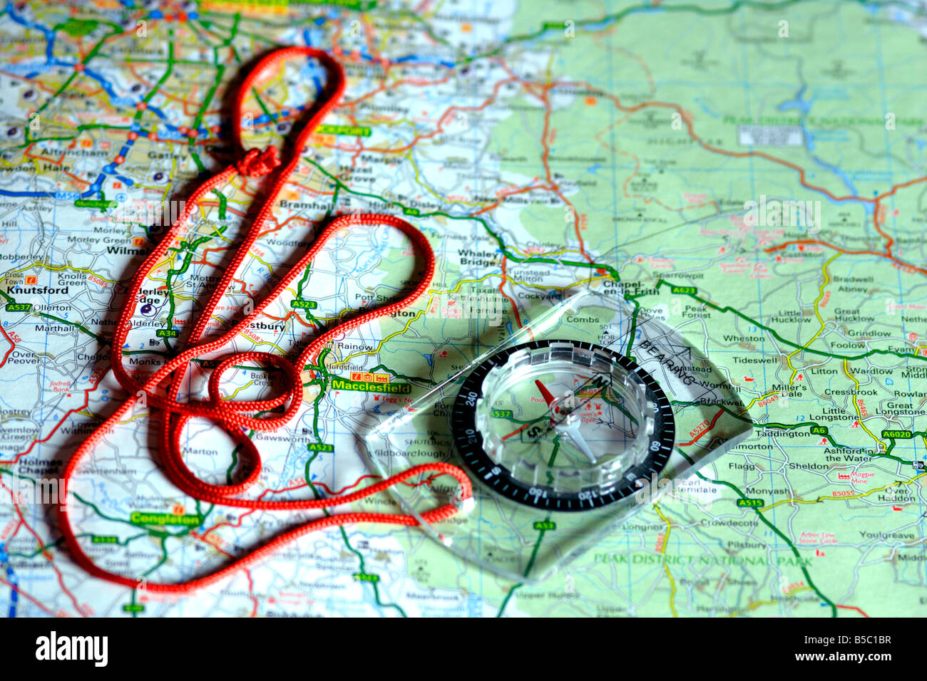 Compass on road map close up Stock Photo - Alamy