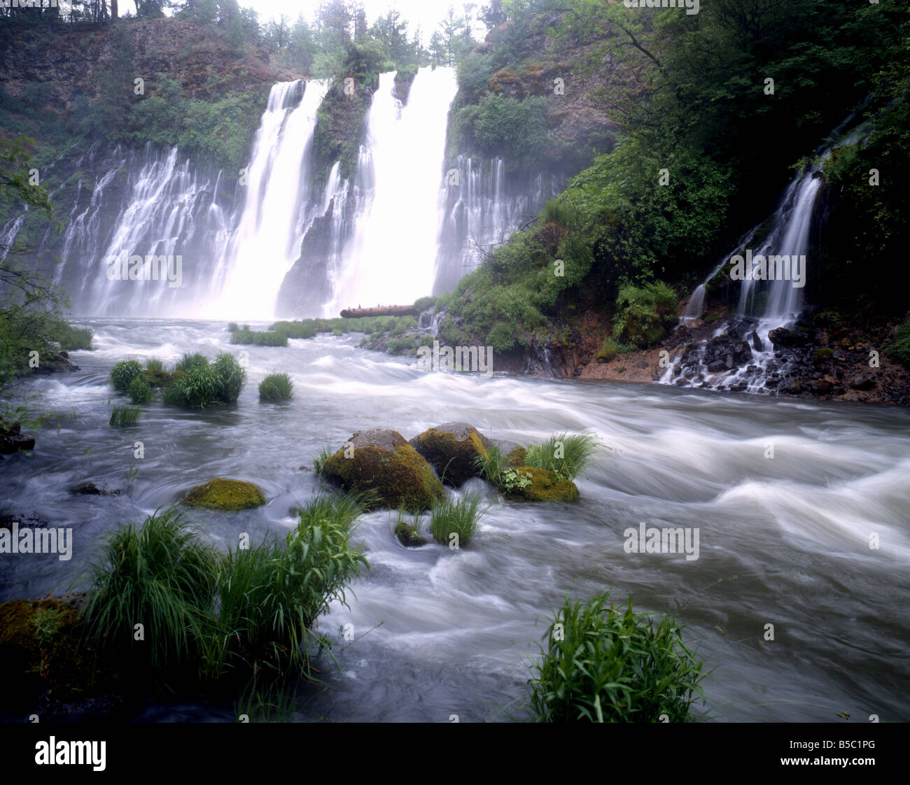 Waterfall into River Stock Photo - Alamy
