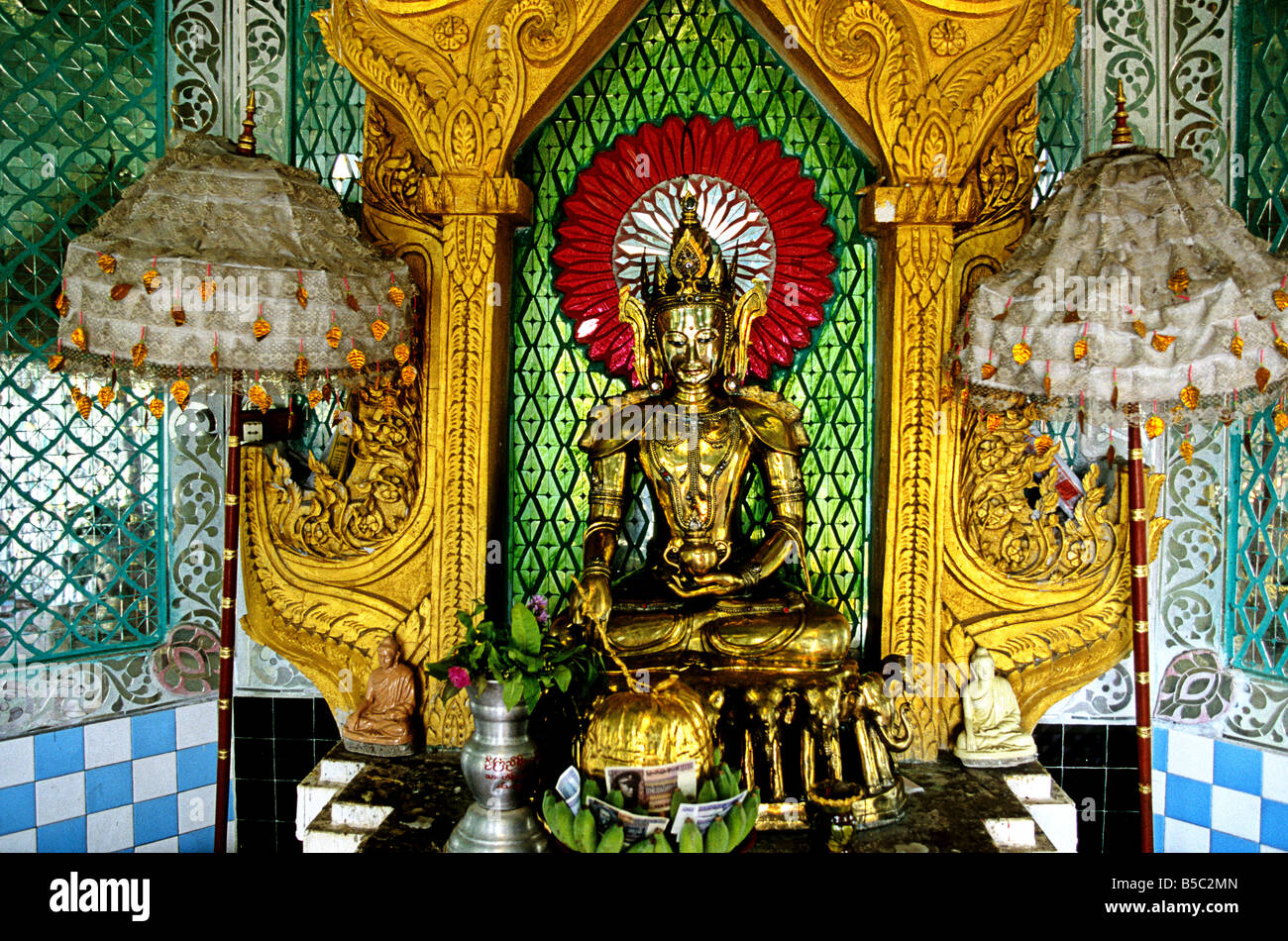 Golden seated Buddha statue at shrine atop Mt Poppa Burma Myanmar Stock ...