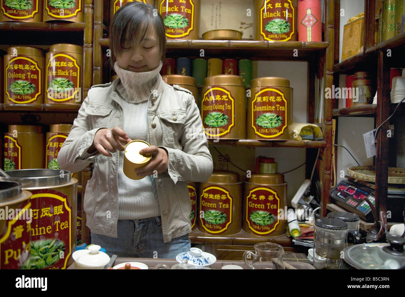 A tea shop hostess in a Hutong neighborhood traditional housing in ...