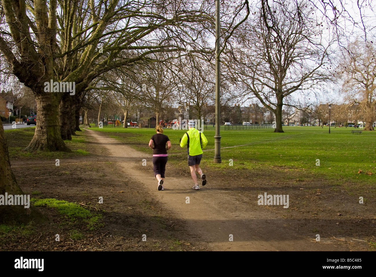 Jogging with a personal trainer at Clapham common park london Stock ...