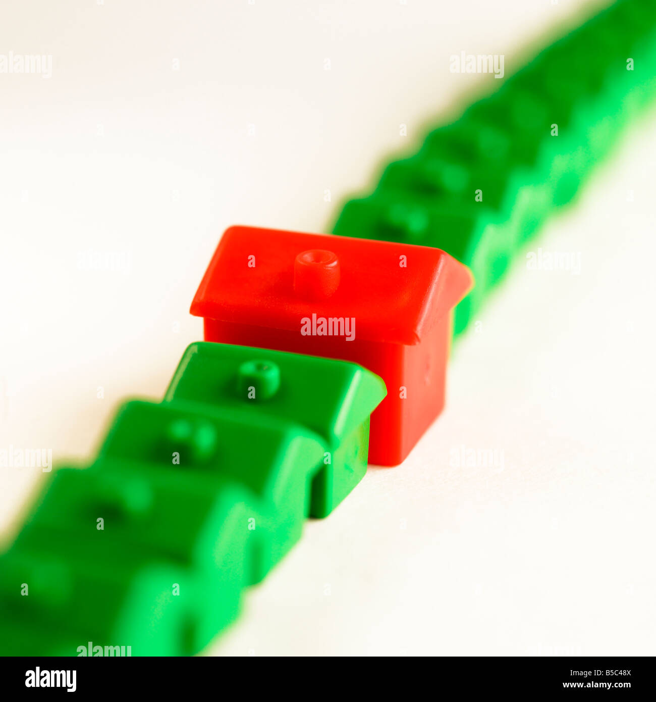 Monopoly house in a row Stock Photo - Alamy