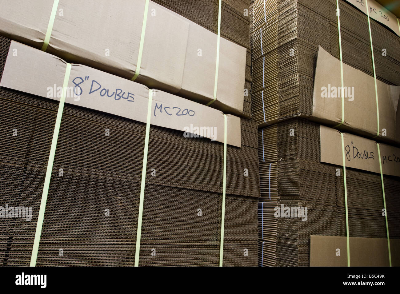 New flat cardboard boxes bundled together Stock Photo - Alamy