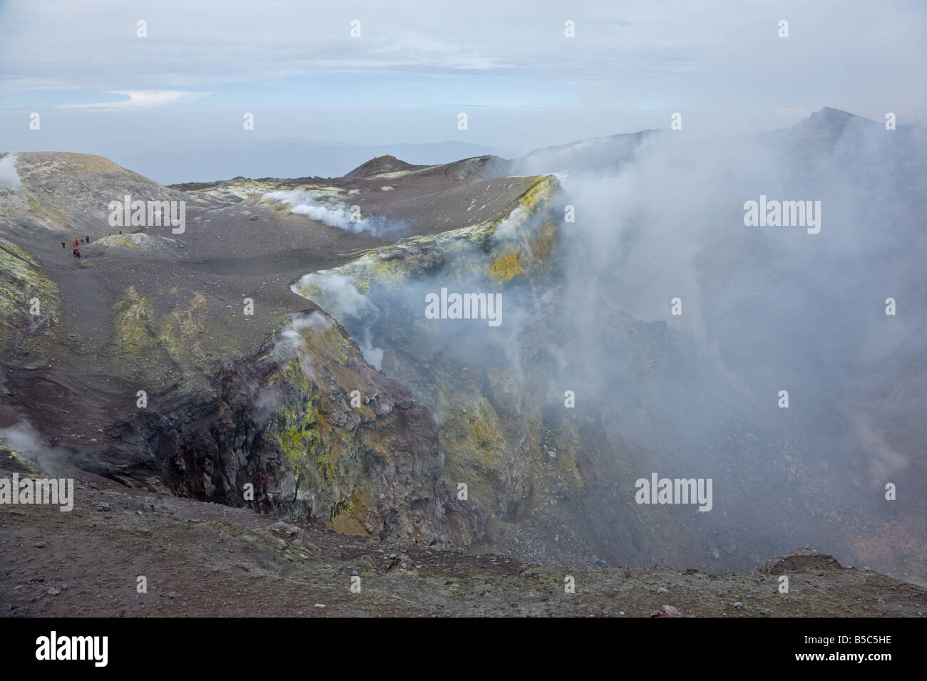 Group of hikers inside Mt. Etna volcano's Bocca Nuova crater Stock ...