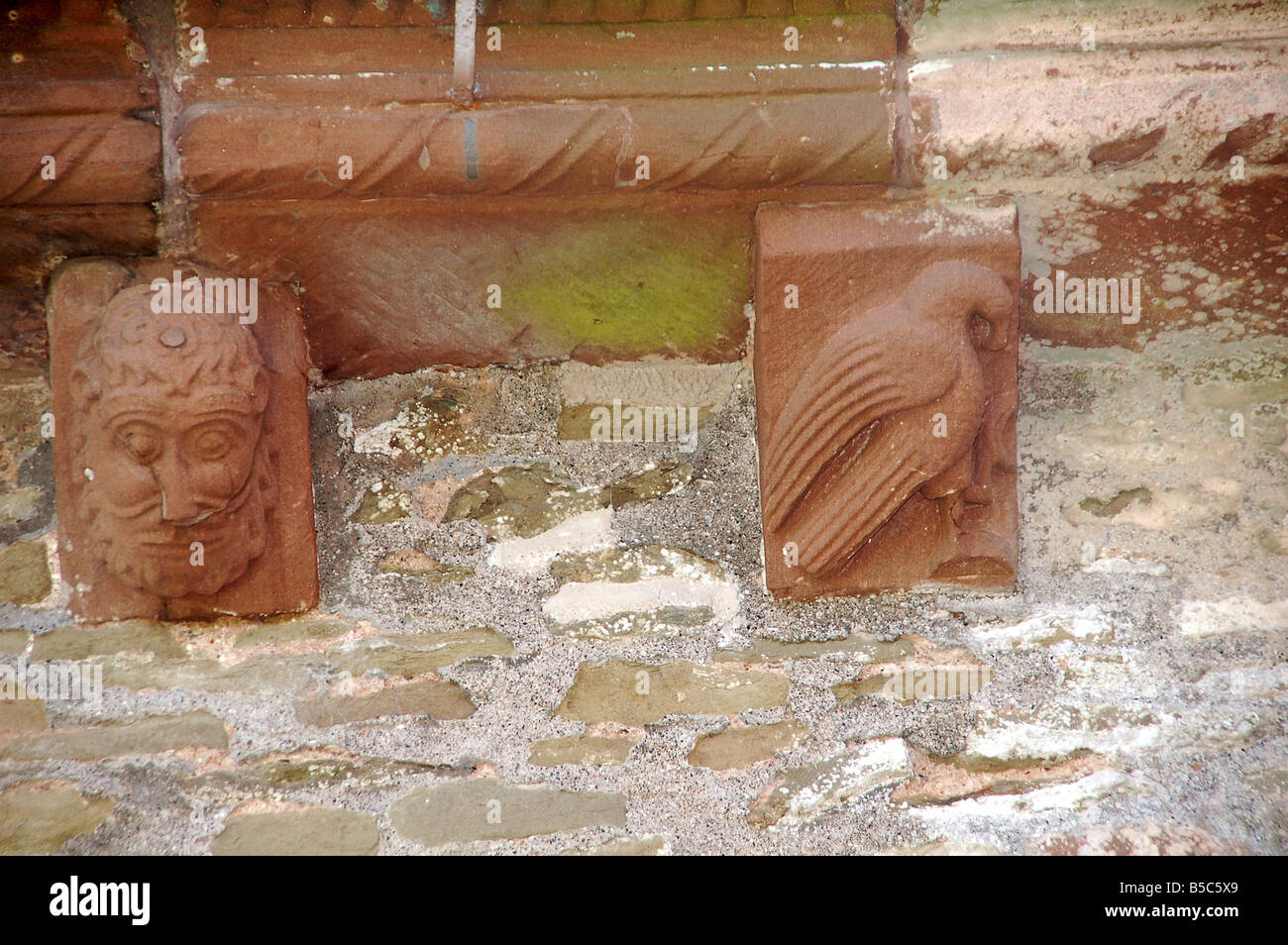2 carved corbels on Kilpeck church in Herefordshire England UK Stock ...