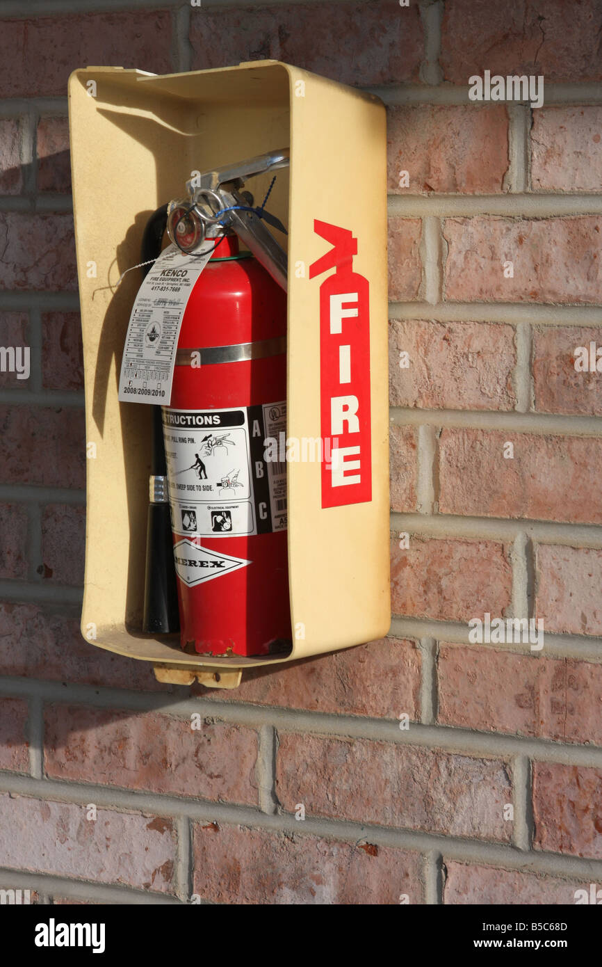 Fire extinguisher on wall at home hi-res stock photography and images ...