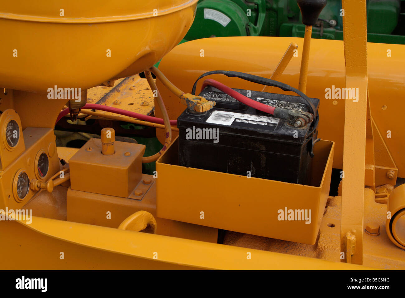 Battery and electrical system components of crawler tractor Stock Photo ...