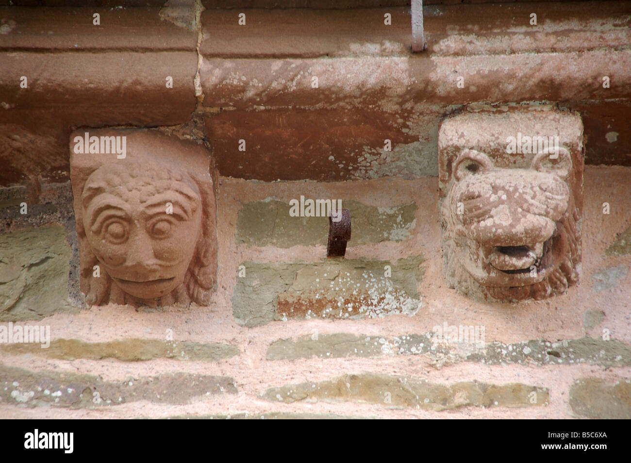 2 carved corbels on Kilpeck church in Herefordshire England UK Stock ...