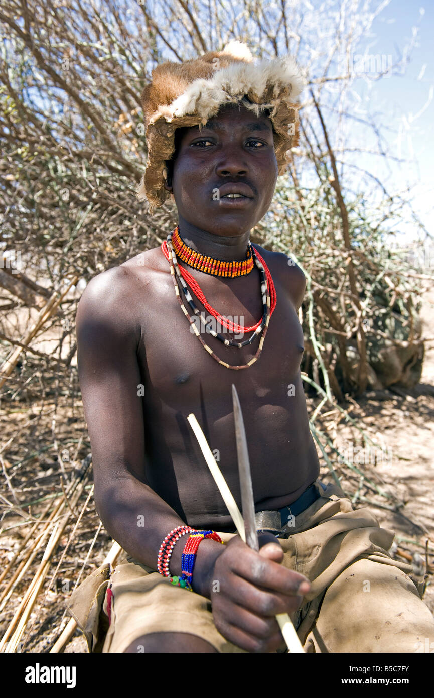 A member of the Hadza tribe prepares to go hunting Lake Eyasi Tanzania ...
