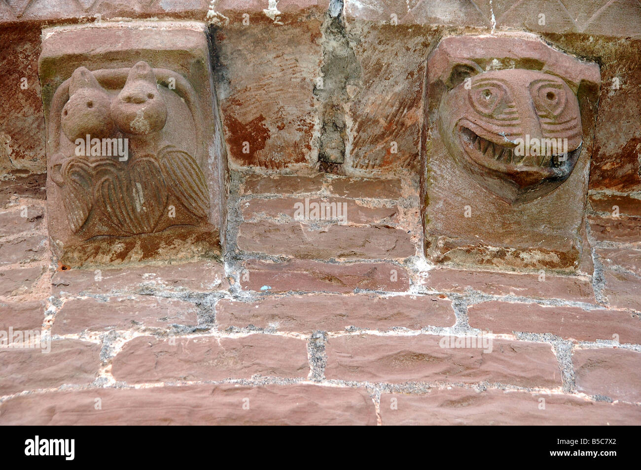 2 carved corbels on Kilpeck church in Herefordshire England UK Stock ...