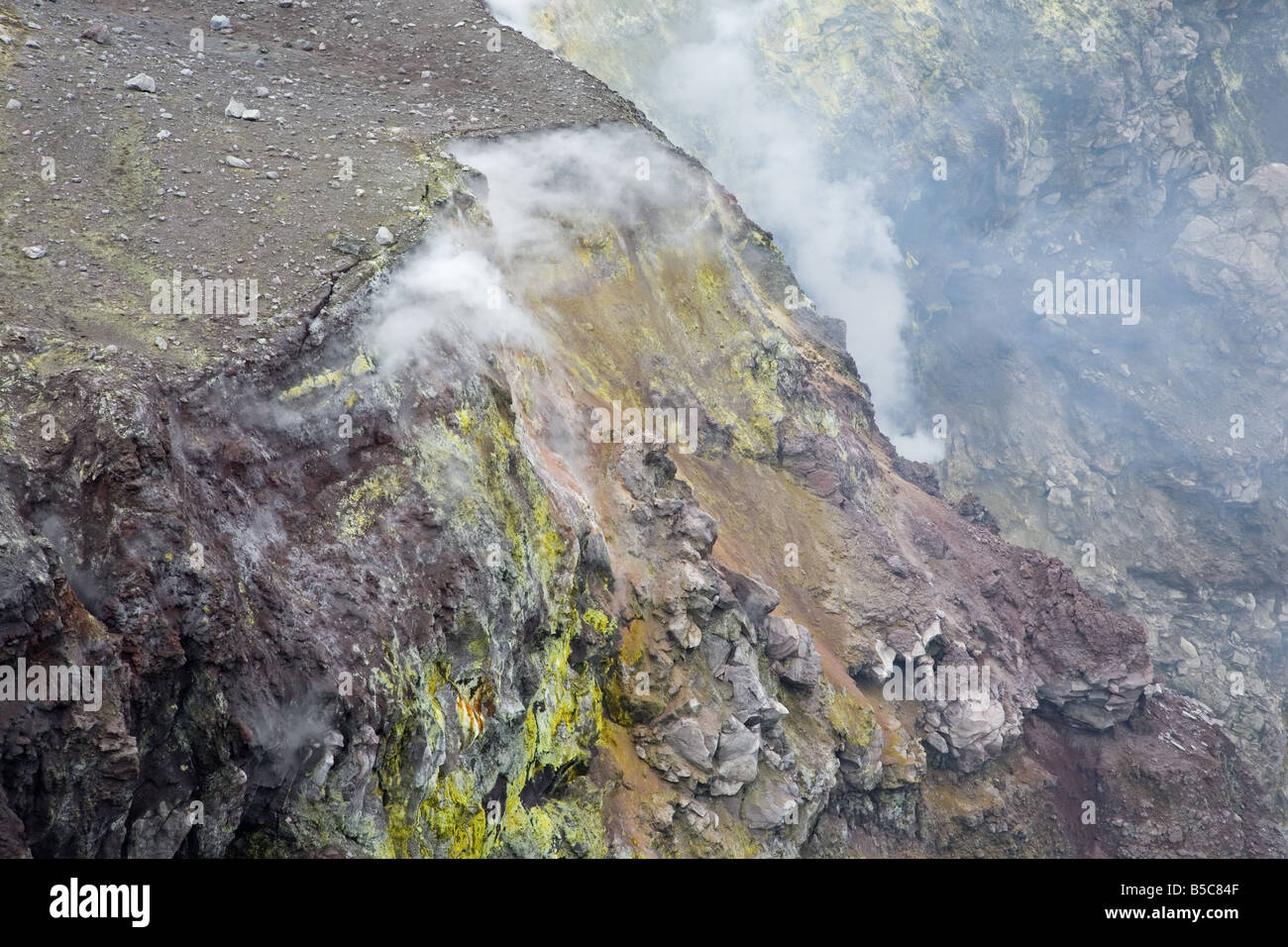 Mt Etna volcano's steep inner crater walls with fumaroles and sulphur ...