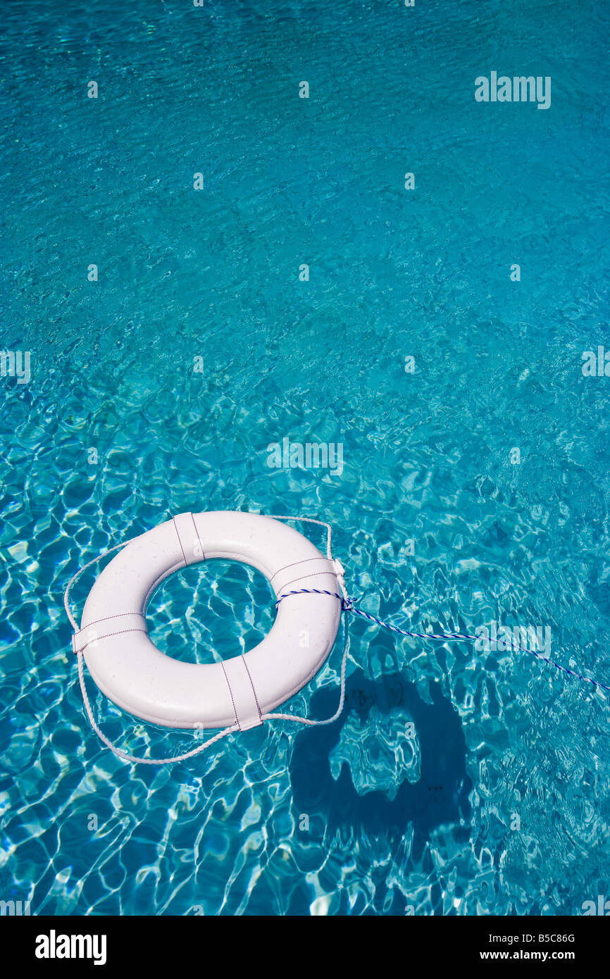 A life preserver floating in a pool Stock Photo - Alamy