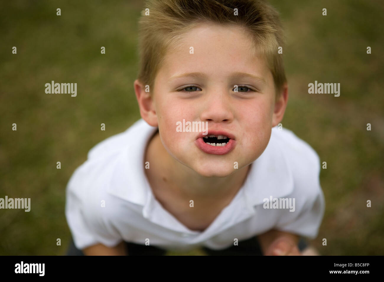 boy portrait pulling a face Stock Photo - Alamy