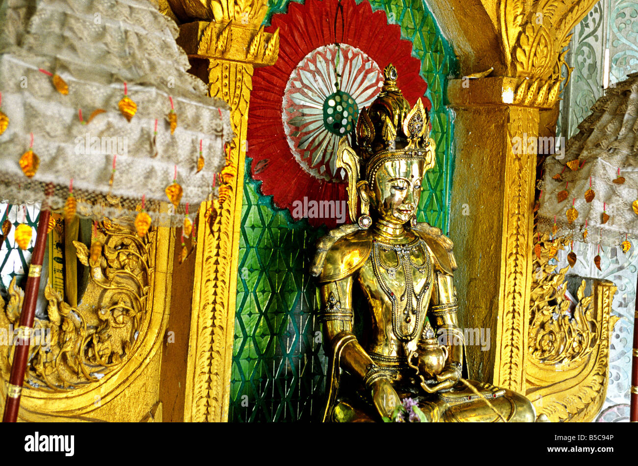 Golden seated Buddha statue at shrine atop Mt Poppa Burma Myanmar Stock ...
