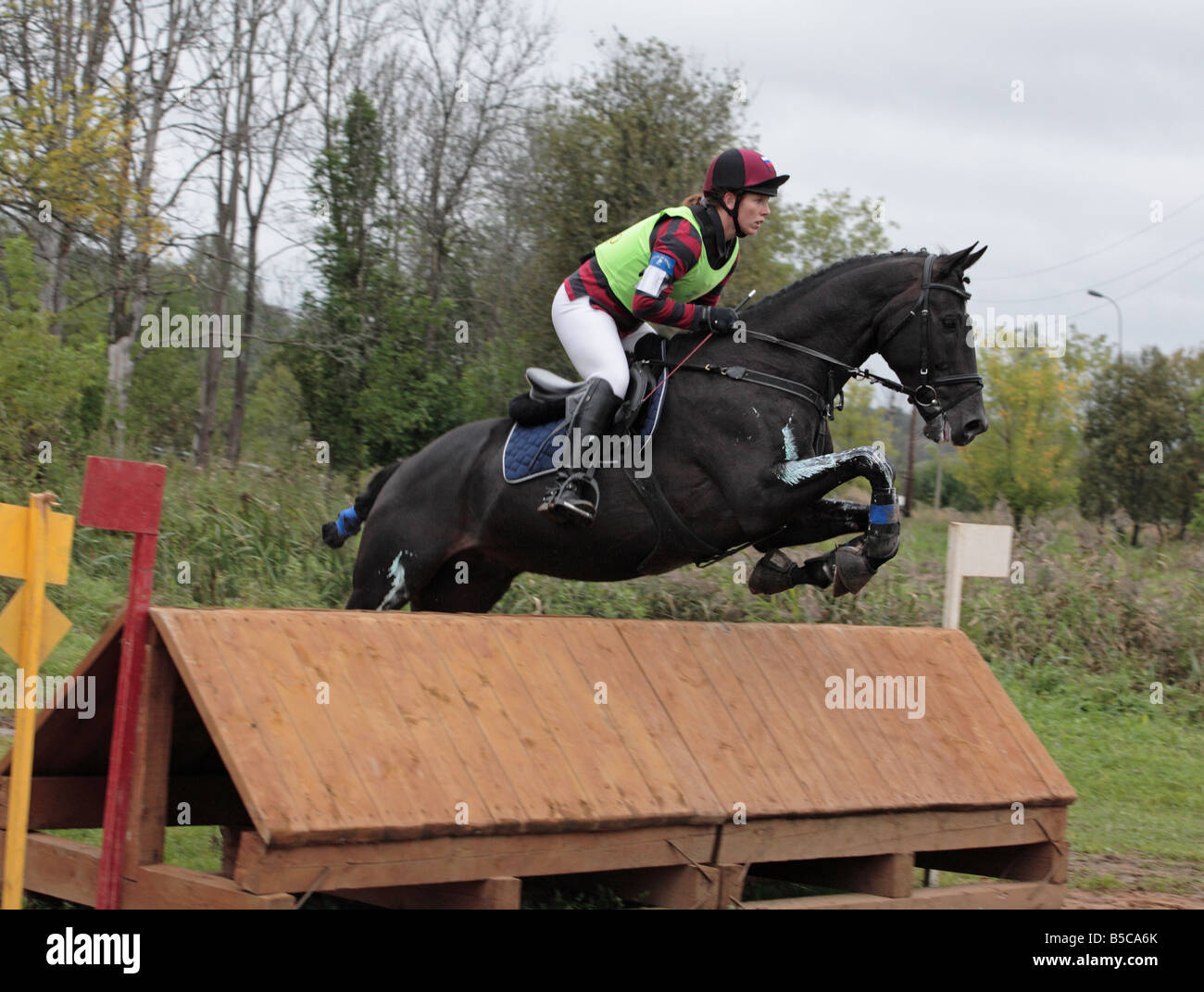 Horse and rider jumping an obstacle at a three day Eventing Competition ...