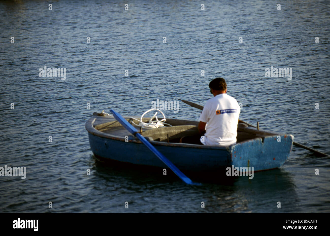 Greece, greek fisherman, rowboat Stock Photo - Alamy