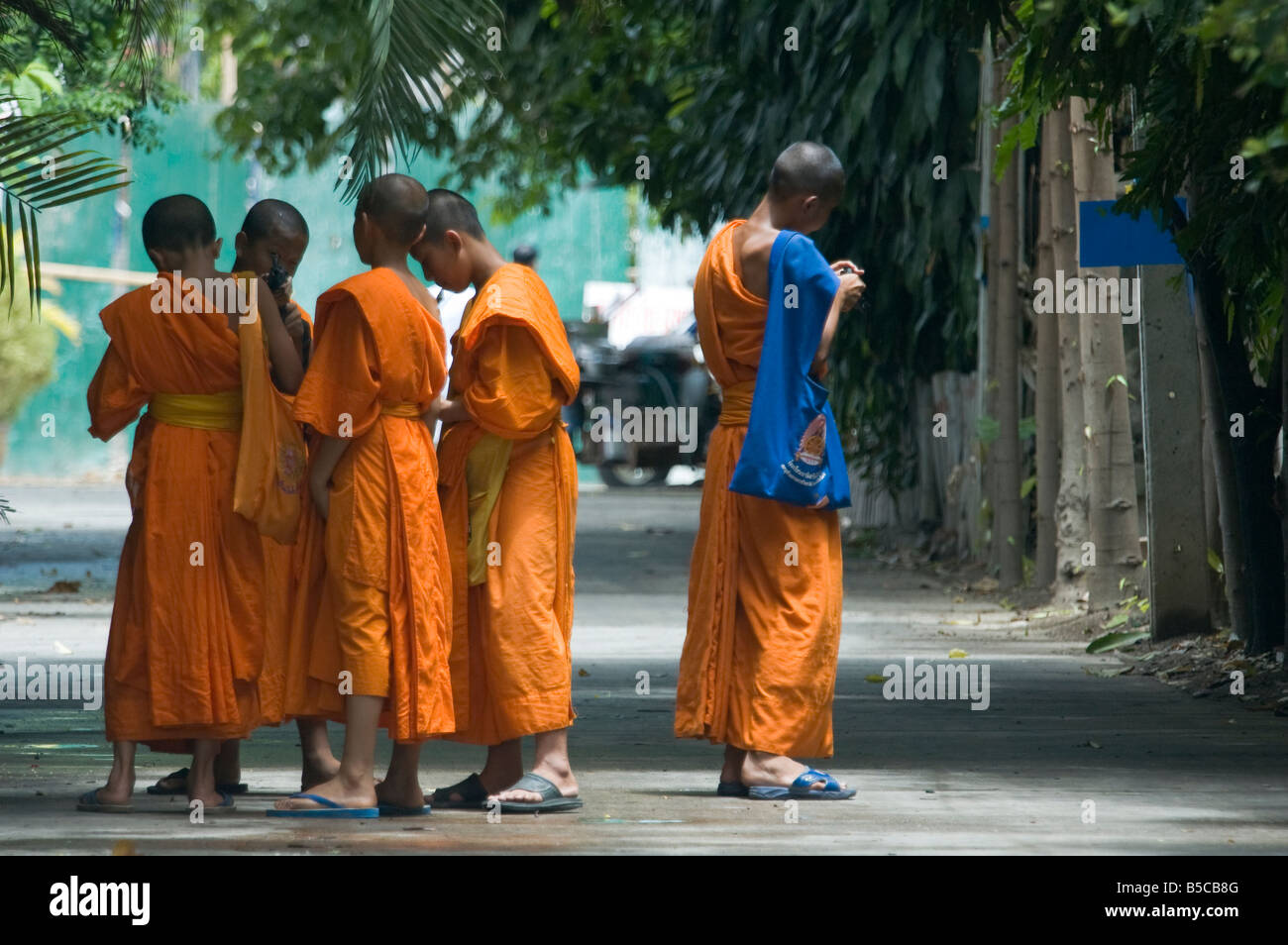 Young monk pointing gun Stock Photo - Alamy