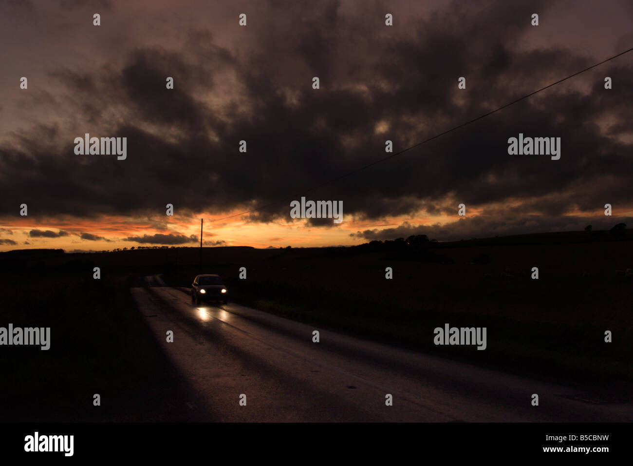 Wet road at sunset dark driving Scotland near Edinburgh Stock Photo - Alamy