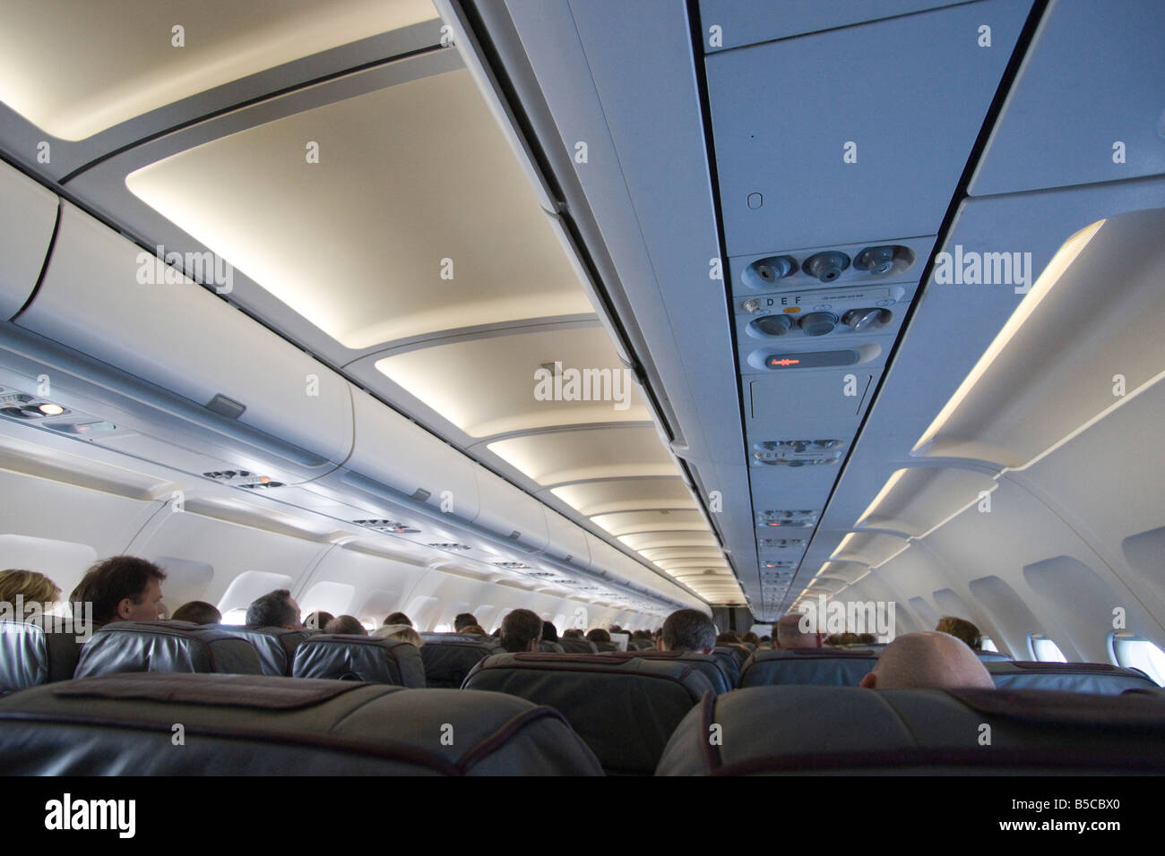 Overhead locker airplane hi-res stock photography and images - Alamy