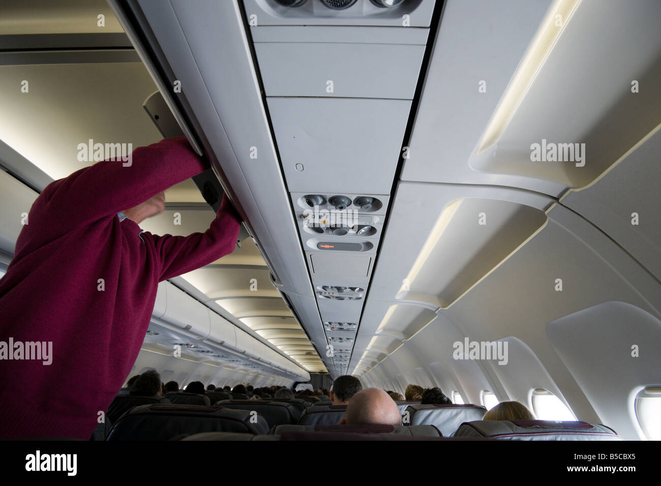 Overheads for cabin baggage stowage in aircraft Stock Photo - Alamy