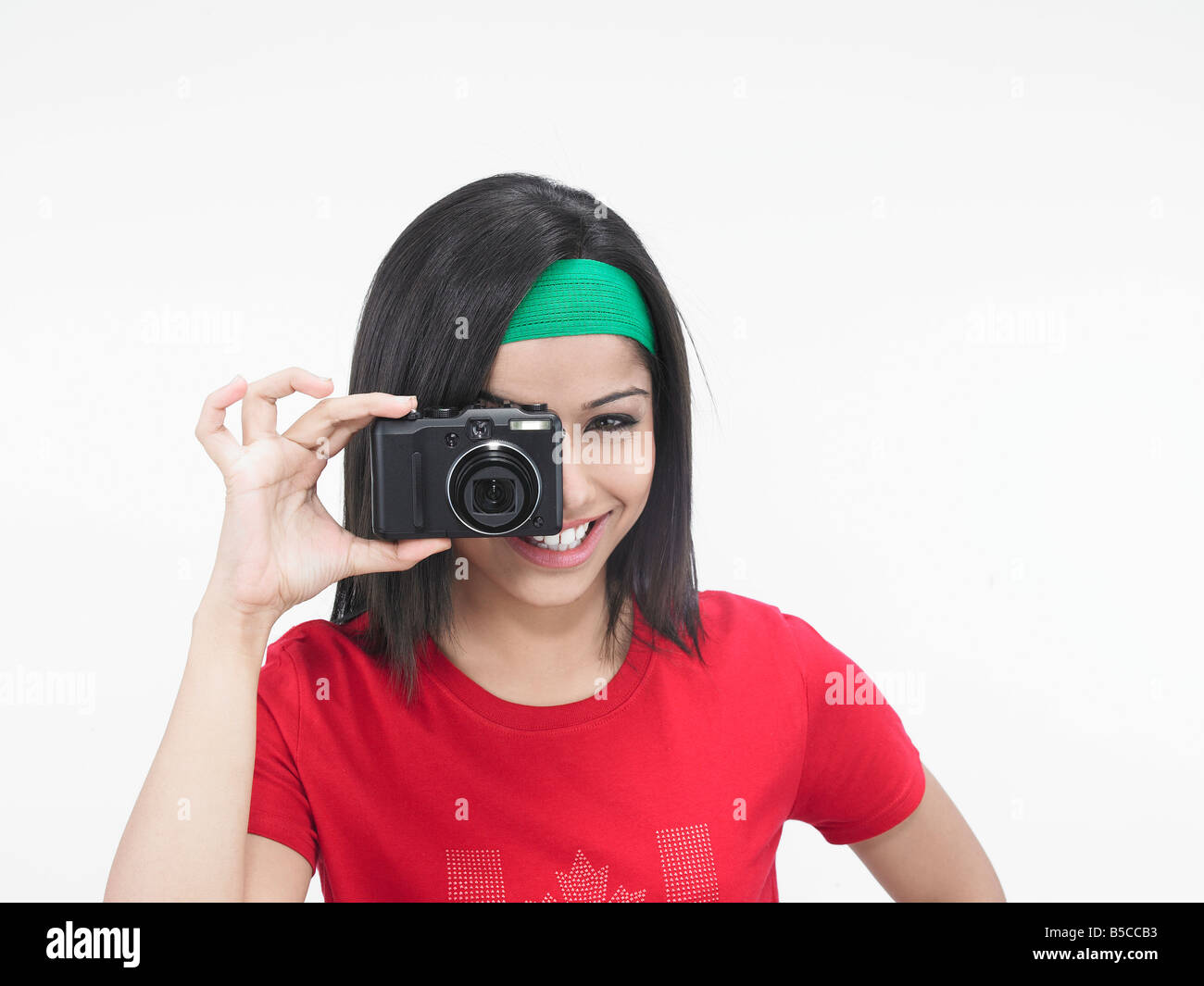 a smart asian woman with a hot shot camera talking picture Stock Photo ...