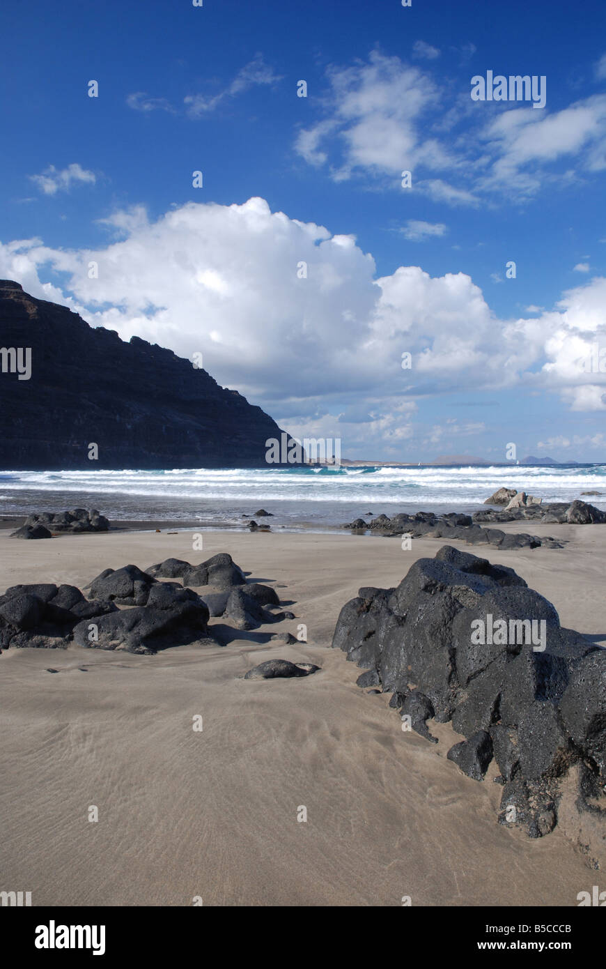 Volcanic rock sand beach blue sea hi-res stock photography and images ...