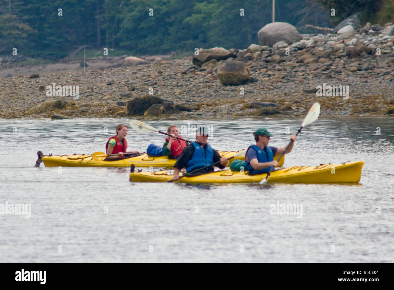 Two men paddling yellow kayaks hi-res stock photography and images - Alamy