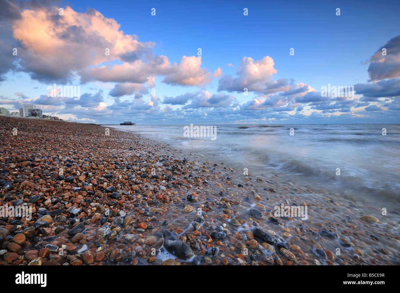 Brighton and Hove beach with pebbles and stones, West Pier in the ...