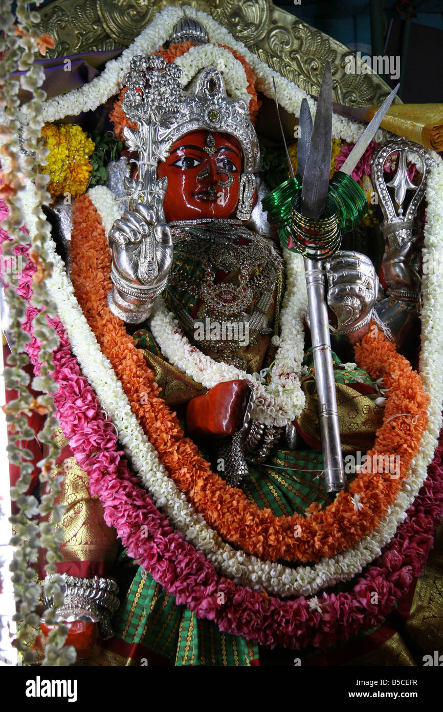 A float showing a Hindu deity is paraded through the streets of Ulsoor ...