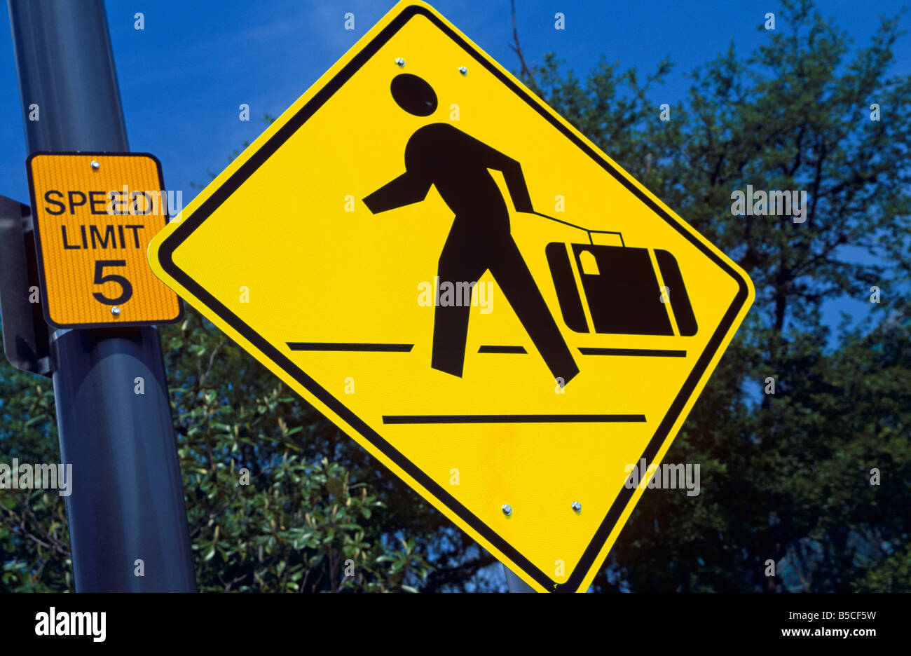 Luggage traffic sign at tourist destination Stock Photo - Alamy