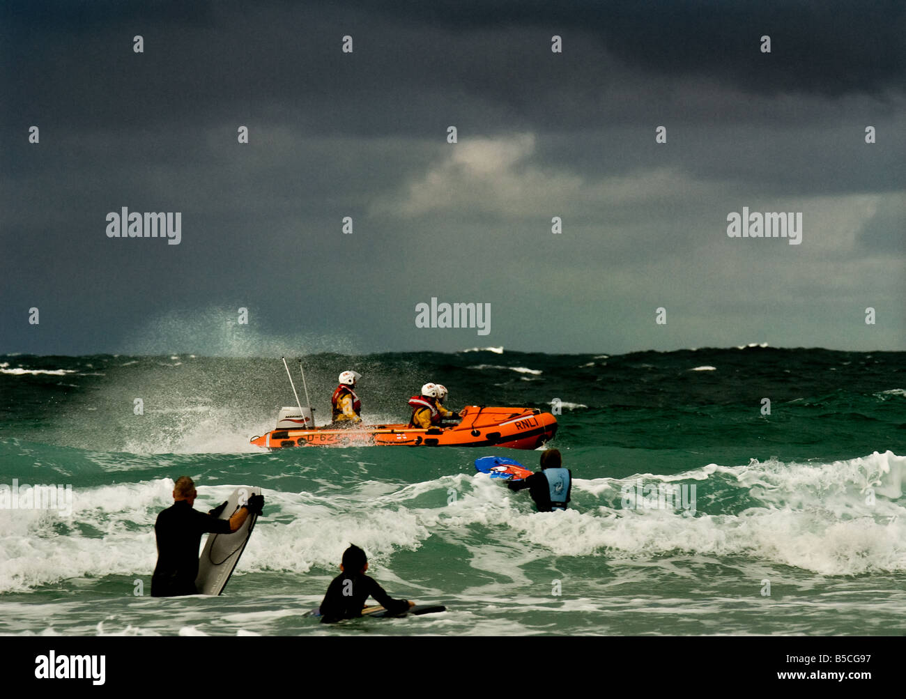 THE RNLI Inshore craft exercising under a dramatic sky at Sennen in ...