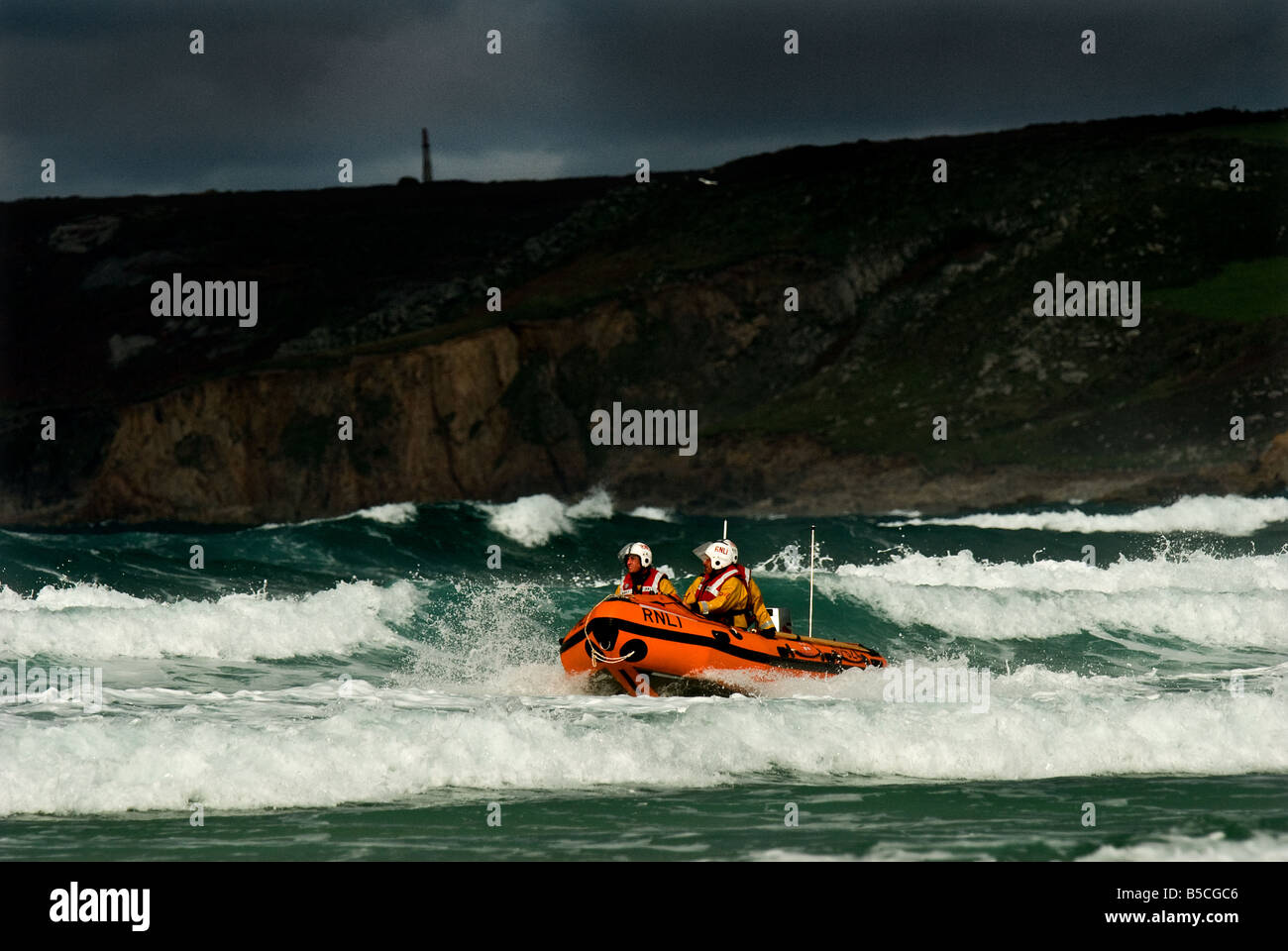 THE RNLI Inshore craft exercising under a dramatic sky at Sennen in ...
