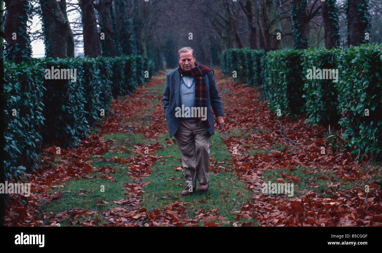 Man walking along a path Stock Photo - Alamy
