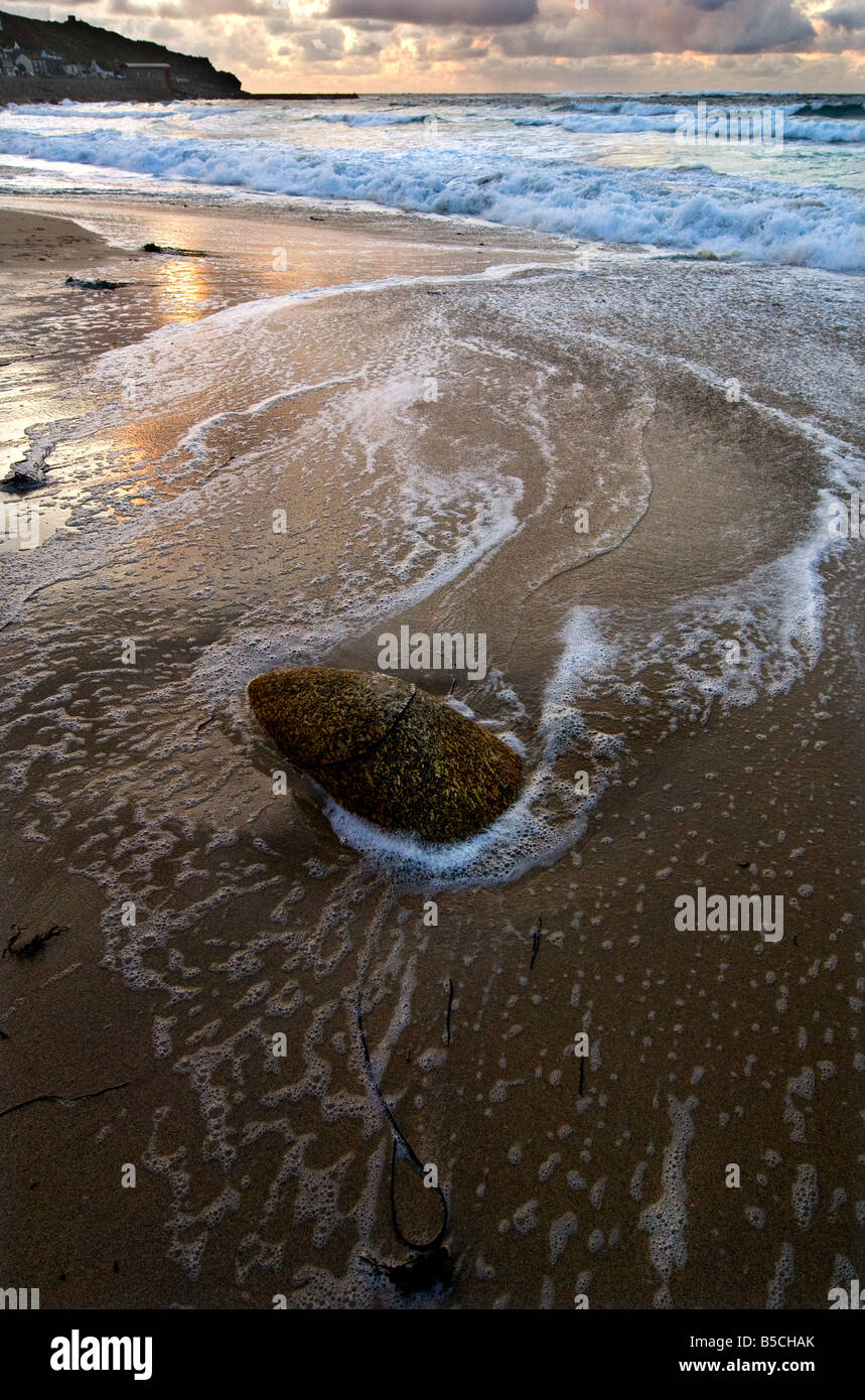 Incoming wave at Sennen in Cornwall Stock Photo - Alamy