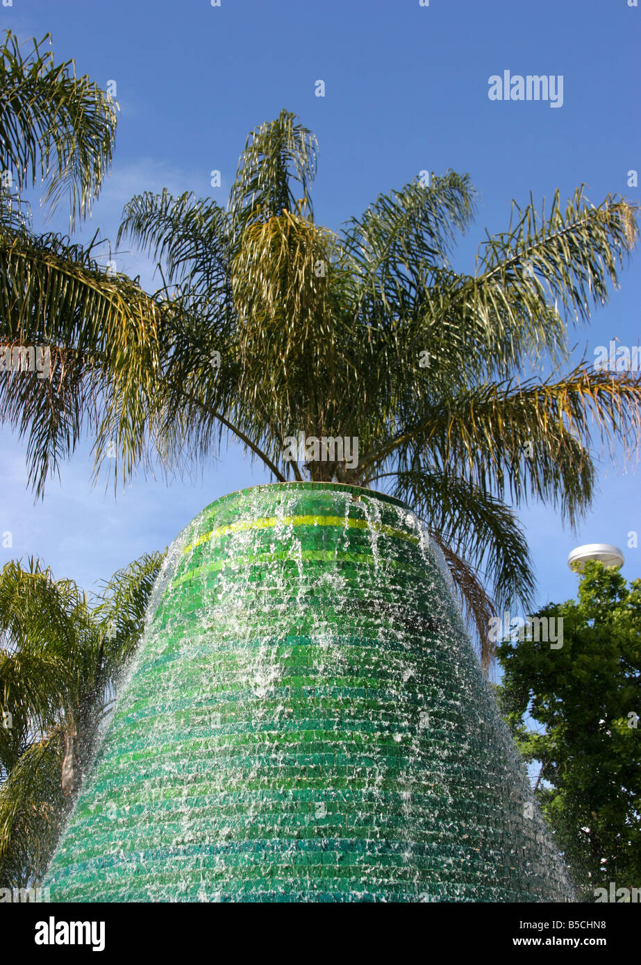 water volcano with a palm tree in background Stock Photo - Alamy